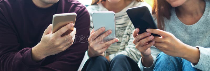 Group of Young People Using and Looking at Mobile Phone Together Stock ...