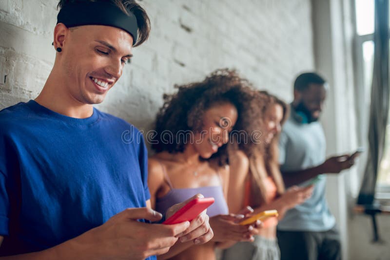 Group of Young People Using Their Smartphones Stock Photo - Image of ...