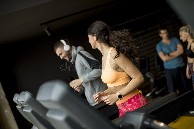 Young People Using Threadmill in Modern Gym Stock Image - Image of ...