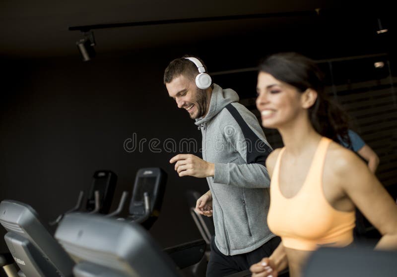 Young People Using Threadmill in Modern Gym Stock Image - Image of ...