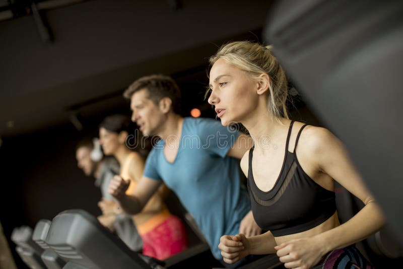 Young People Using Threadmill in Modern Gym Stock Image - Image of ...