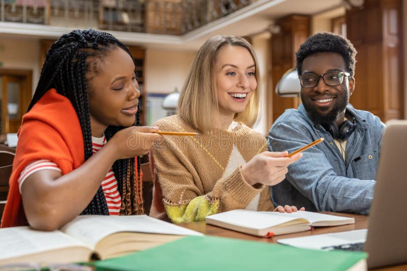 Group of Young People Working on the Project Together and Looking ...