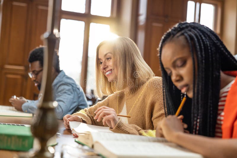 Group of Young People Working on the Project Together and Looking ...