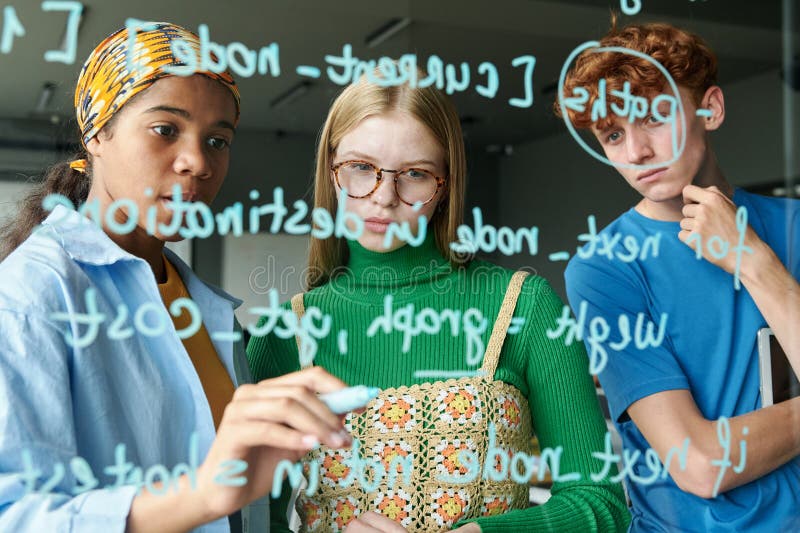 Students Writing on Glass Wall in Team Stock Image - Image of ...