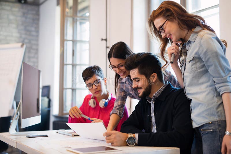Group of Young Perspective Architects Looking at Project Papers Stock ...