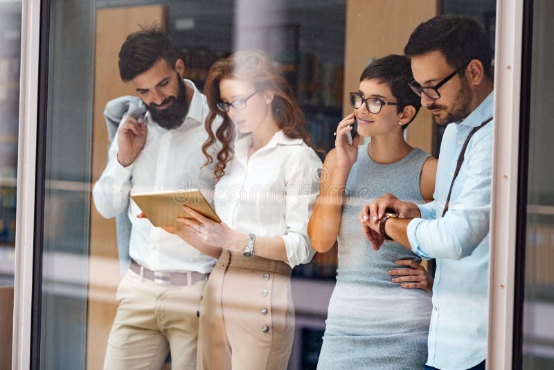 Group of Young Perspective Businesspeople Having Discussion Stock Photo ... Group of Young Perspective Businesspeople Having Discussion Stock Photo ...