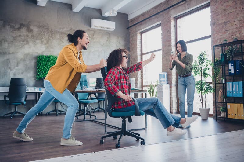 Young Diverse Colleagues Enjoying Teamwork with Laughter in a Modern ...
