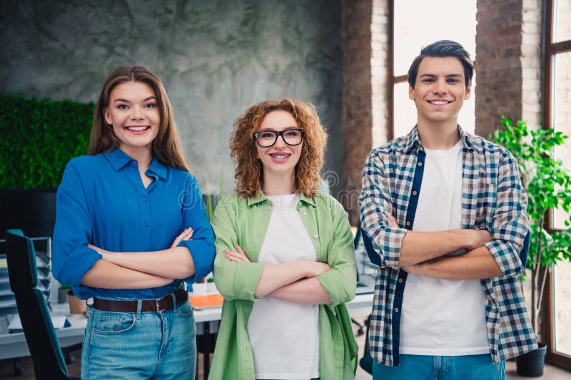 Group of Young Professionals Smiling Confidently while Standing in a ...