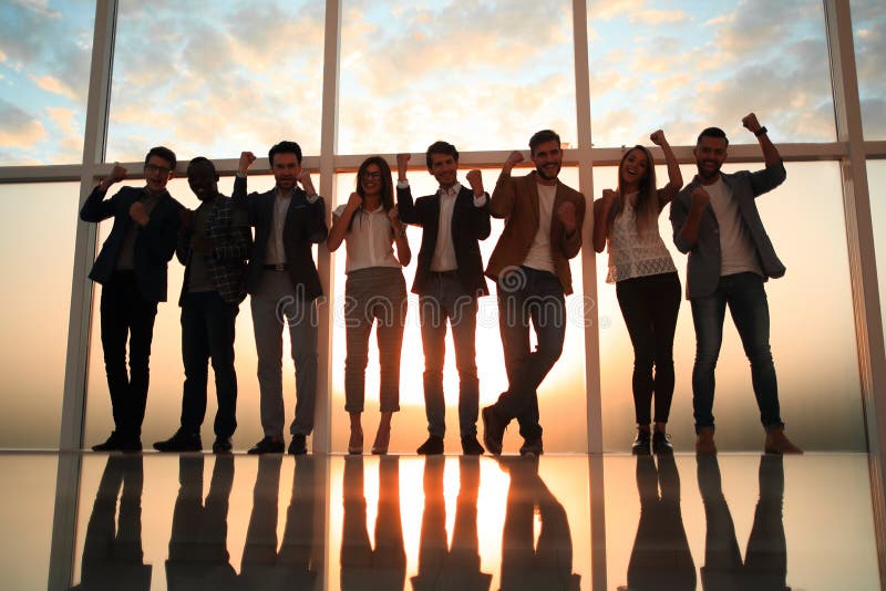 Group of Young Professionals Standing in an Office with a Large Window ...
