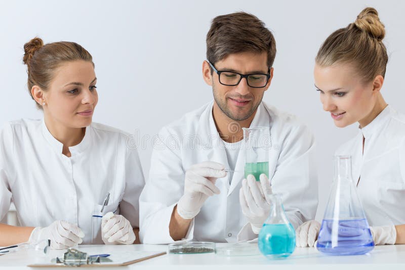 Group of young scientists stock photo. Image of biochemistry - 80800684