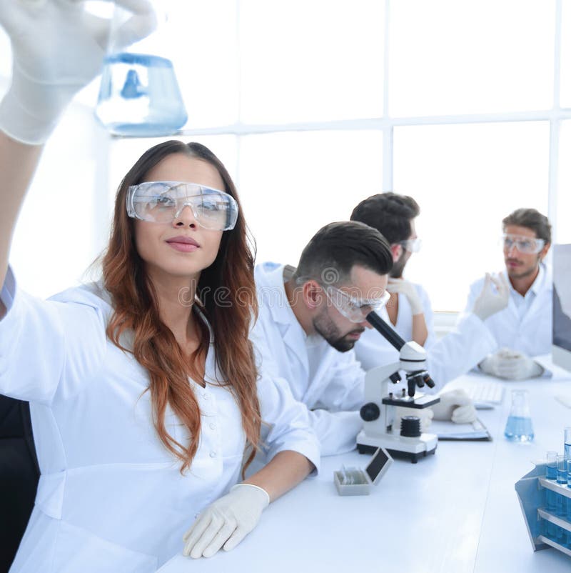 Group of Young Scientists Working in the Laboratory. Stock Photo ... Group of Young Scientists Working in the Laboratory. Stock Photo ...