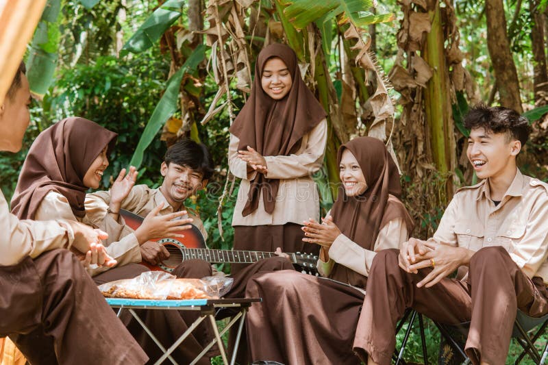 Group of Young Scouts Singing with Guitar beside a Tent Stock Photo ...
