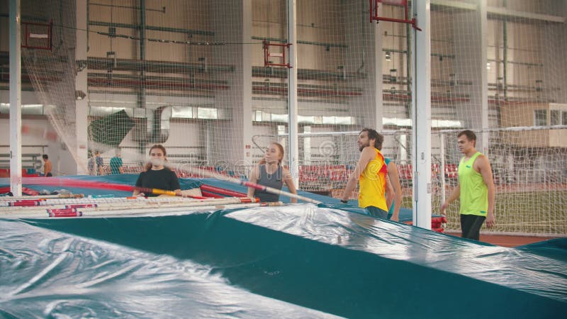 Group of Young Smiling People on the Pole Vault Training Taking Their ...
