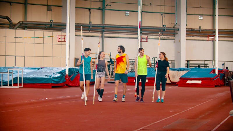 Pole Vault Training on the Stadium - Young Woman with Long Hair ...