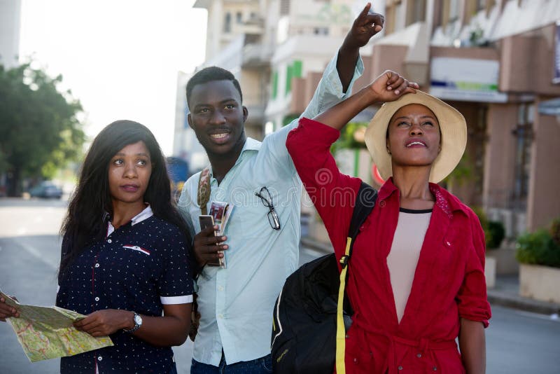 Group of Young Smiling Tourists Stock Photo - Image of african, mobile ...