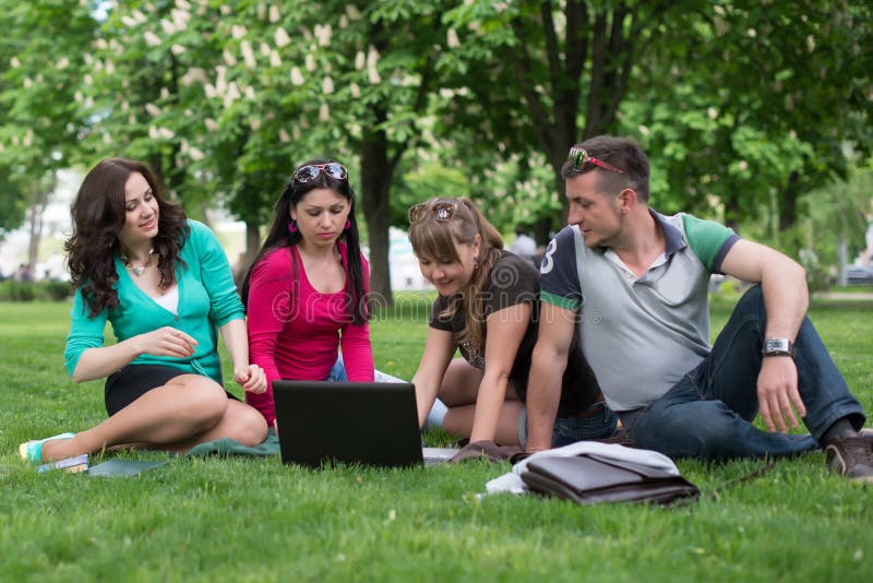 Group of Young Student Using Laptop Together Stock Image - Image of ...