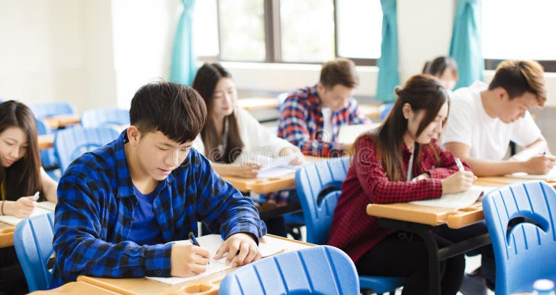 Group of Students Using Smart Mobile Phones in Classroom Stock Photo ...