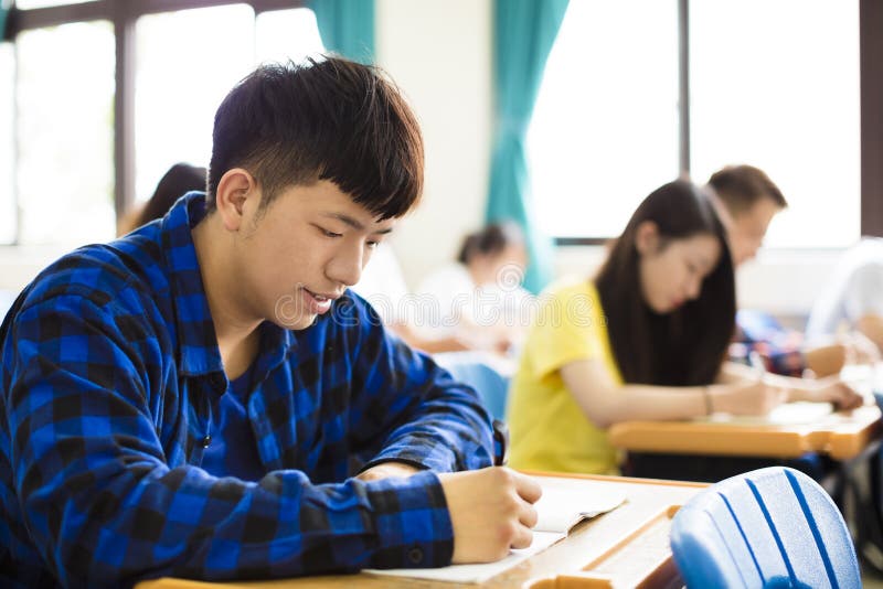Group of Young Students Writing Notes in the Classroom Stock Image ...
