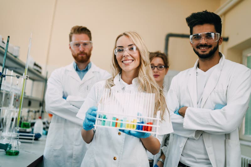 Group of Young Successful Scientists Posing for Camera Stock Photo ...