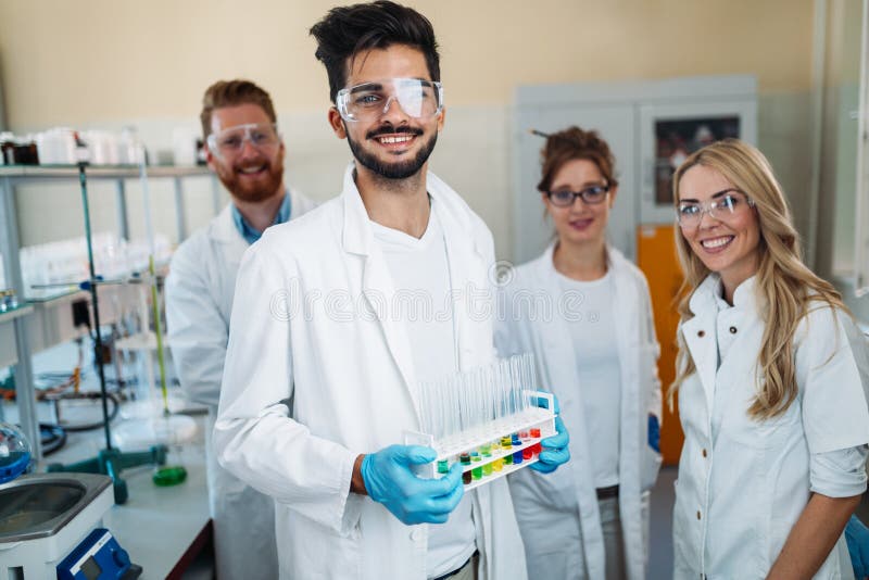 Group of Young Successful Scientists Posing for Camera Stock Photo ...