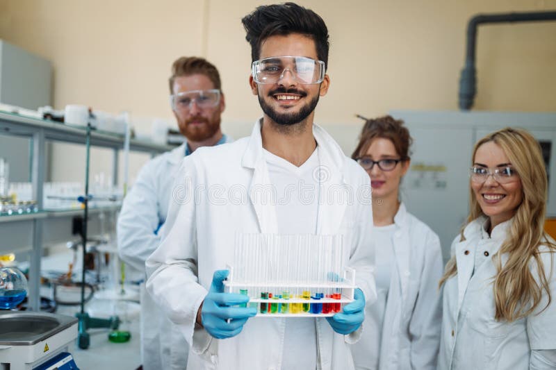 Group of Young Successful Scientists Posing for Camera Stock Image ...