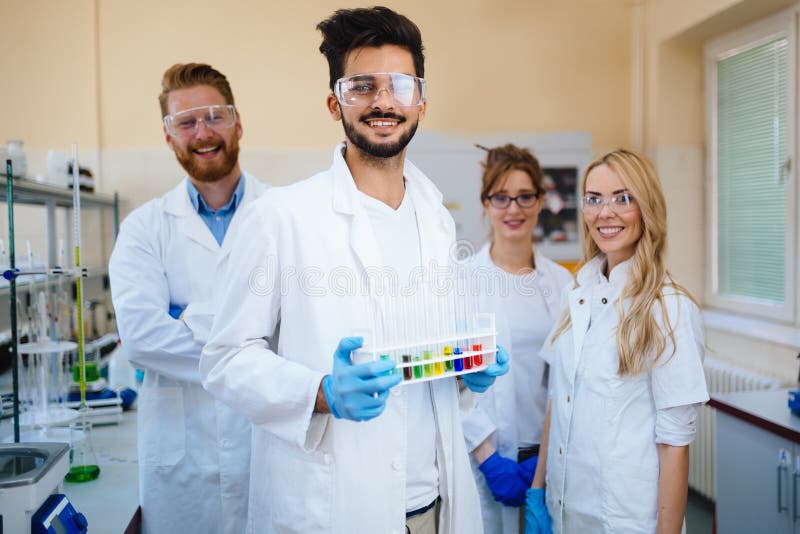Group of Young Successful Scientists Posing for Camera Stock Photo ...