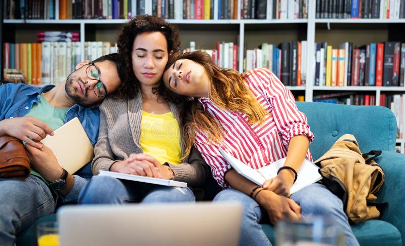 Group of Young Tired Students Studying, Learning for Exam in Library ...