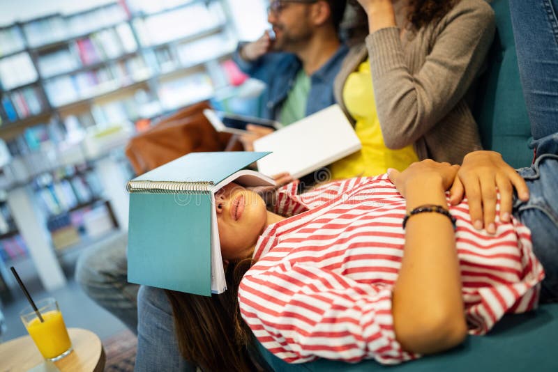 Group of Young Tired Students Studying, Learning for Exam in Library ...