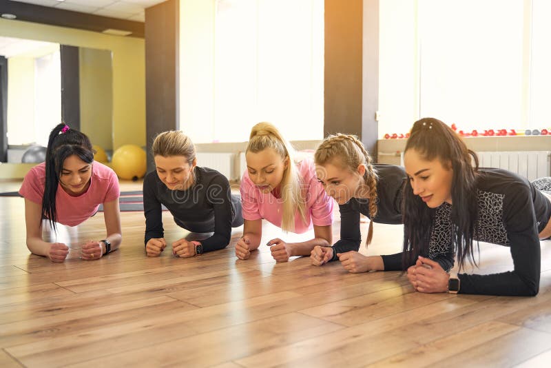 Group of Young Women Doing Plank Together in Gym Stock Image - Image of ...