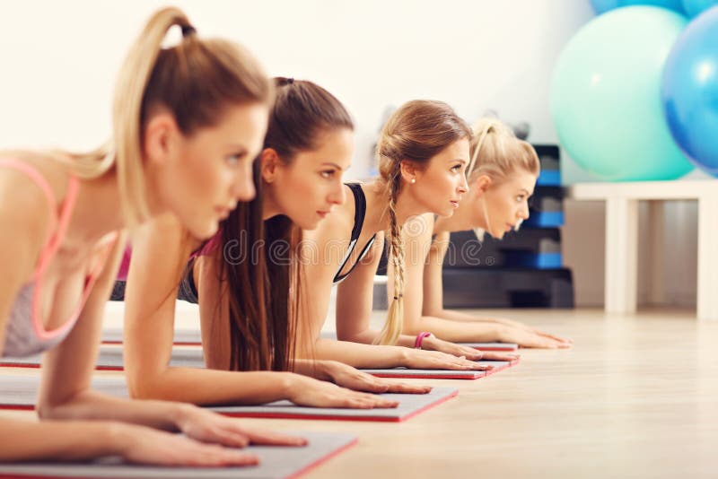 Group of Young Women Doing Plank Together in Gym Stock Image - Image of ...