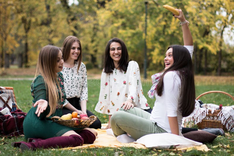 Group of Young Women Out on a Fun Picnic in the Park Stock Photo ...