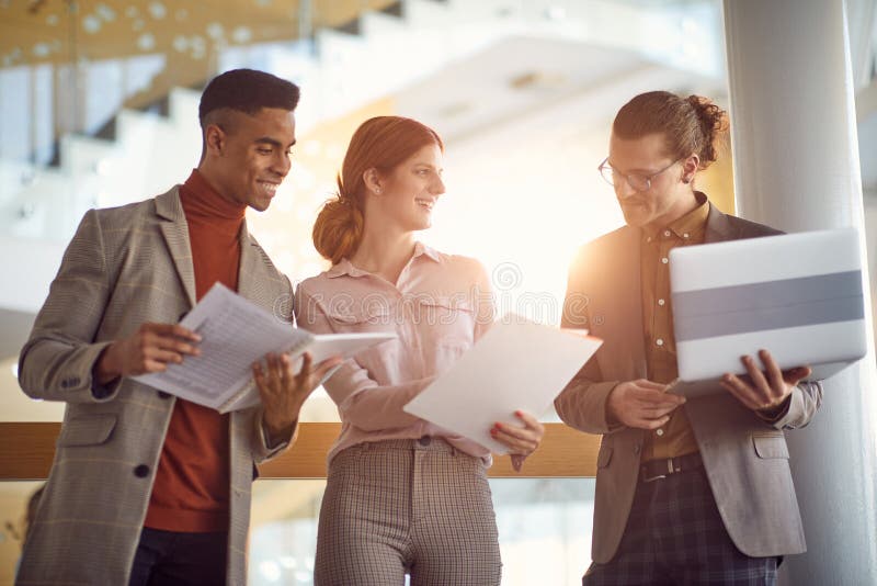 Group of Young Work Colleagues Consulting Stock Image - Image of group ...