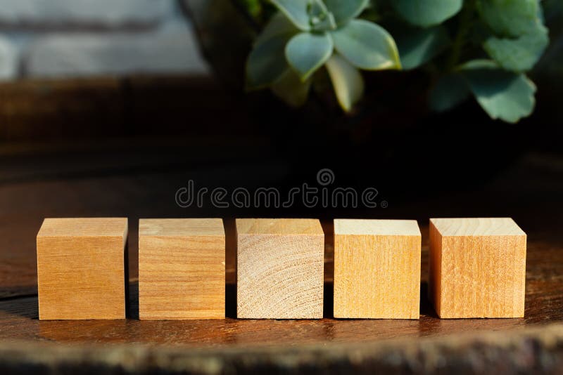 Groupped Wooden Square Blocks on Dark Wooden Table Stock Photo - Image ...