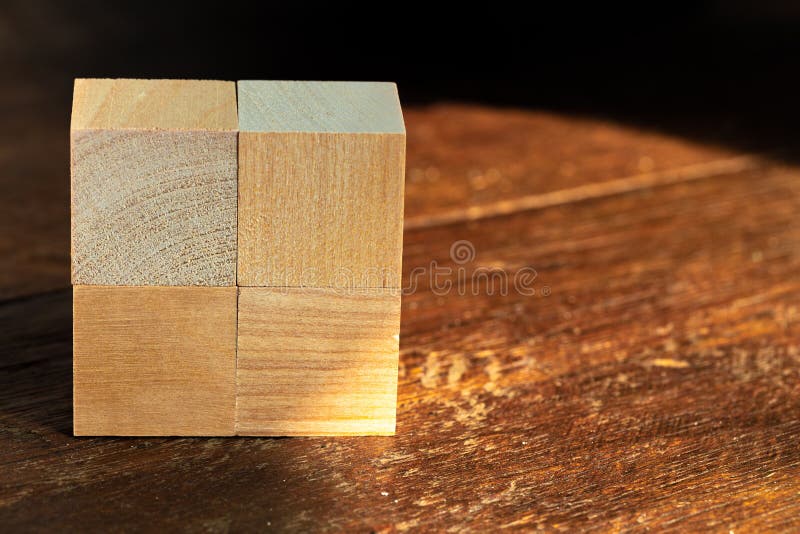 Groupped Wooden Square Blocks on Dark Wooden Table Stock Photo - Image ...