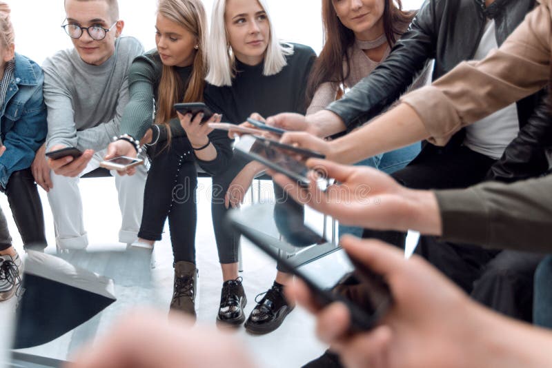Groups of Young People Reading Messages on Their Smartphones Stock ...