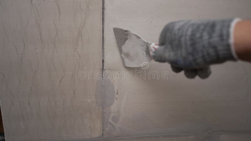 Construction of a Wall from Tongue-and-groove Slabs. Spatula with ...