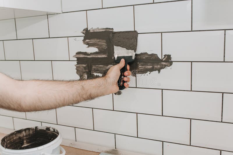 Grouting Tiles in the Kitchen. Repair Stock Photo - Image of material ...