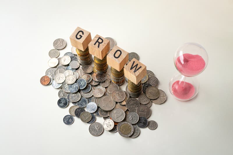 Grow word on top of coins stock image. Image of business - 368777553