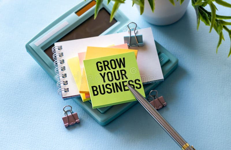 Grow Your Business Words on Office Table with Computer, Flower, Notepad ...