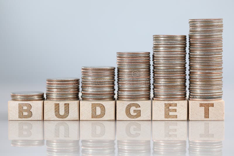 Growing Pile of Silver Coins Standing at Budget Sign Stock Image ...