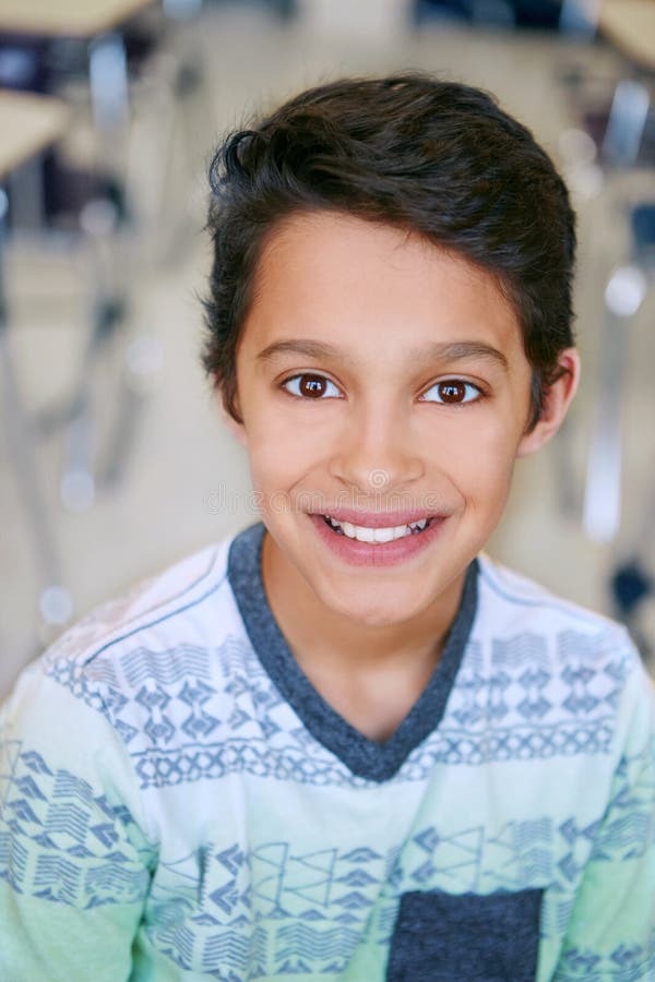 Growing Up Confidently. Portrait of a Smiling Elementary Student at ...