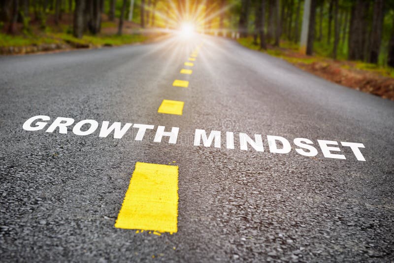 Growth Mindset with Yellow Arrow Marking on Road Surface with White ...
