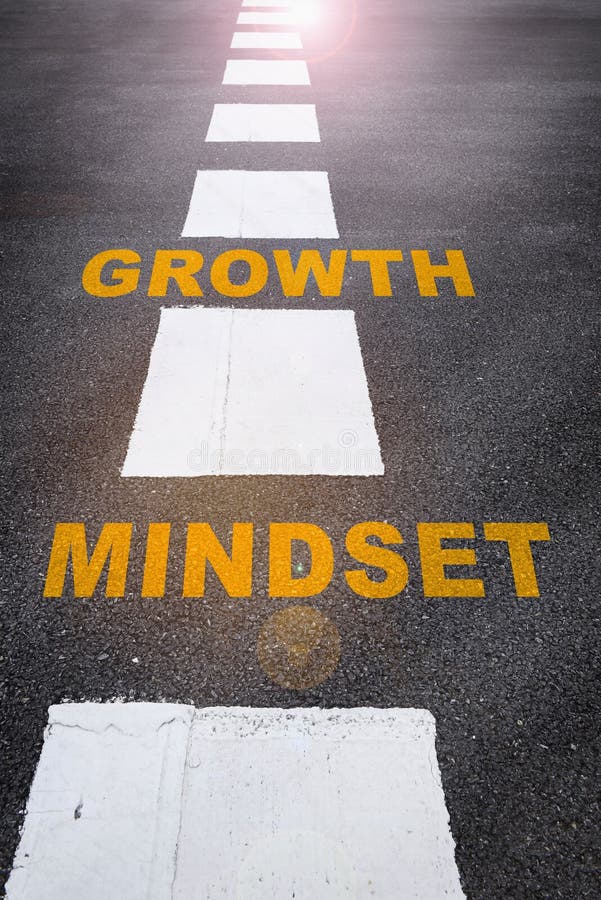 Growth Mindset with Yellow Arrow Marking on Road Surface with White ...