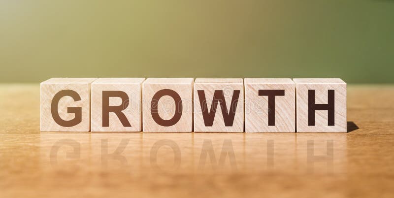 GROWTH Word Written on Wooden Blocks on Wooden Table. Concept for Your ...