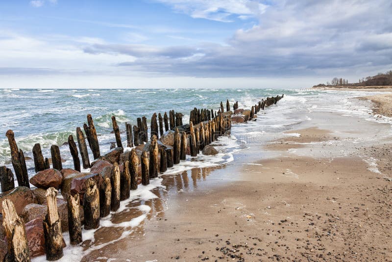 Groyne on shore stock image. Image of ocean, clouds, destination - 44979063