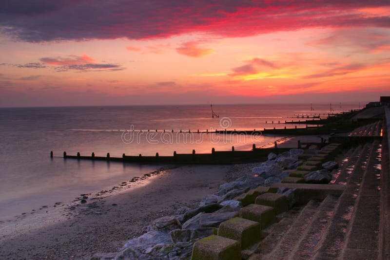 Groynes at sunset stock image. Image of peace, ocean, beach - 547289