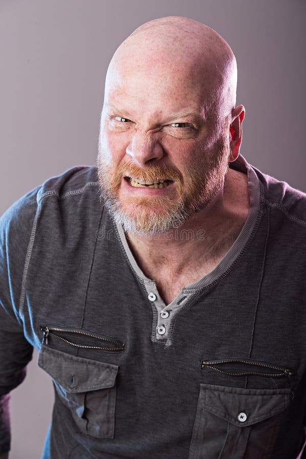 Grumpy bald man stock photo. Image of constipated, face - 113112510