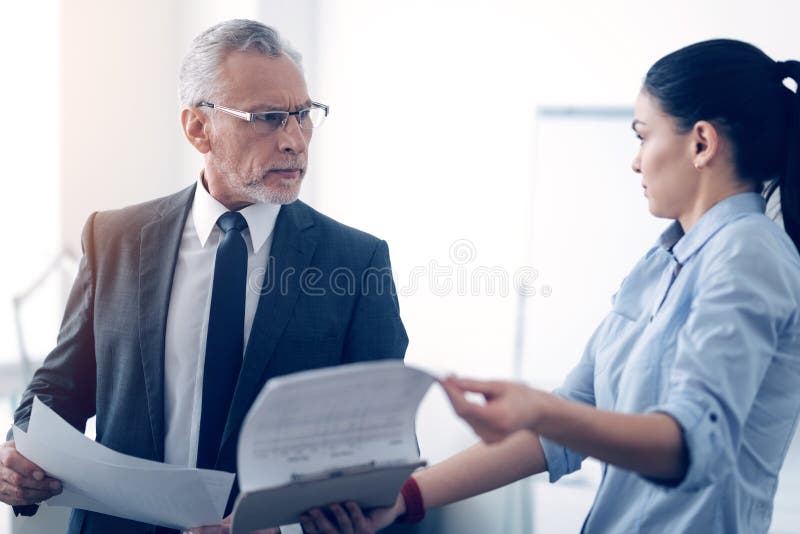 Grumpy Chief and His Female Office Worker Arguing Over Documents Stock ...