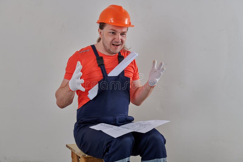 A Very Grumpy Engineer Examines Project Drawings Carefully Stock Image ...