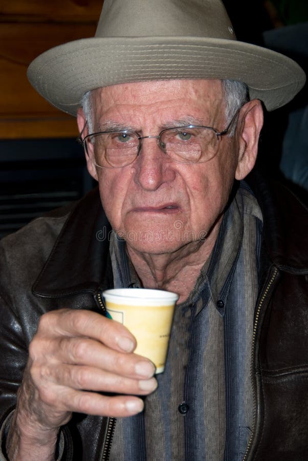 Grumpy Senior before His Morning Coffee. Stock Image - Image of ...